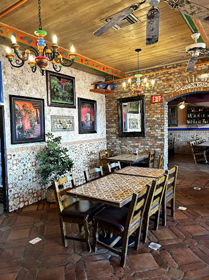 The dining area balances rustic charm with authentic details&mdash;those colorful tiles and wooden ceiling create an atmosphere that enhances every bite.