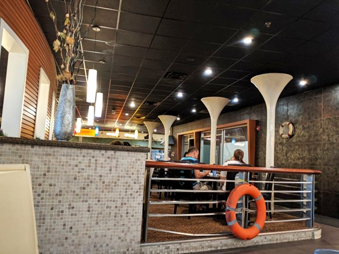 Nautical touches like life preservers and sleek design elements remind you of the seafood mission. Maritime chic without going overboard on the theme.