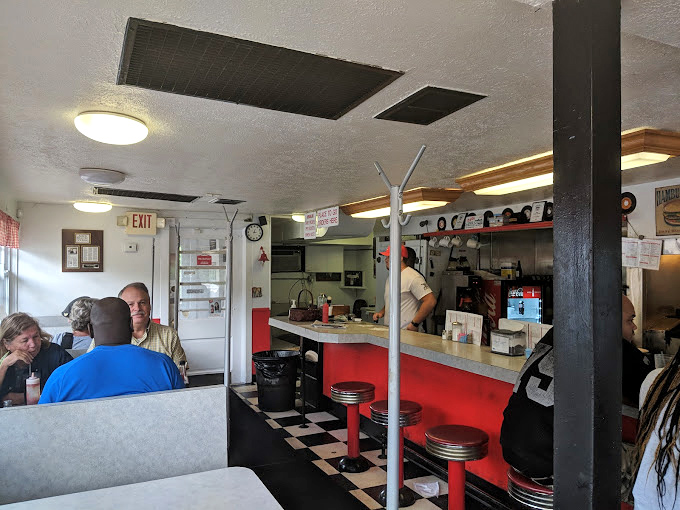 Where strangers become friends over shared tables and the symphony of sizzling burgers provides the soundtrack to authentic Akron dining experiences.