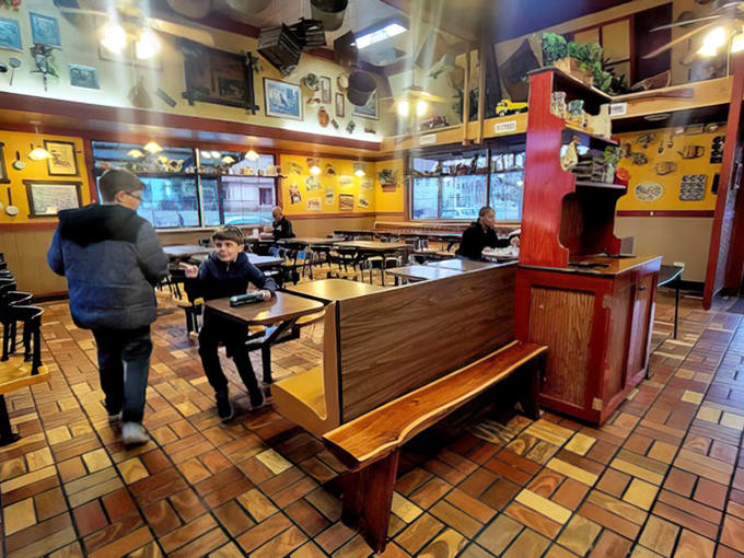 The dining room buzzes with locals who know the secret: sometimes the best meals come from the most unassuming places.