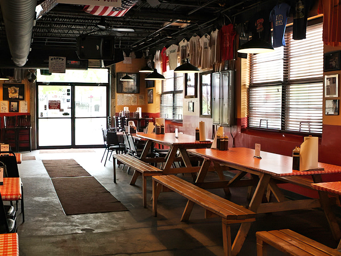 Picnic tables inside mean one thing: focus on the food, not the furniture. The American flag and sports memorabilia remind you you're in BBQ country.