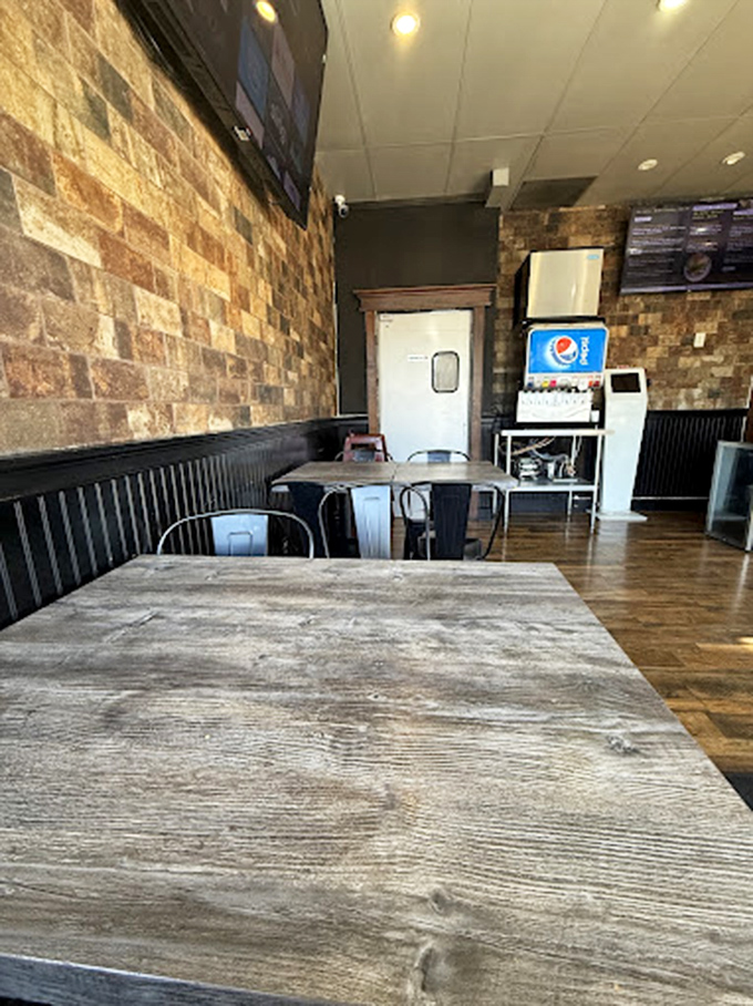 Industrial-chic meets burger joint practicality. The simple seating area invites you to focus on what matters: the food that's about to arrive.