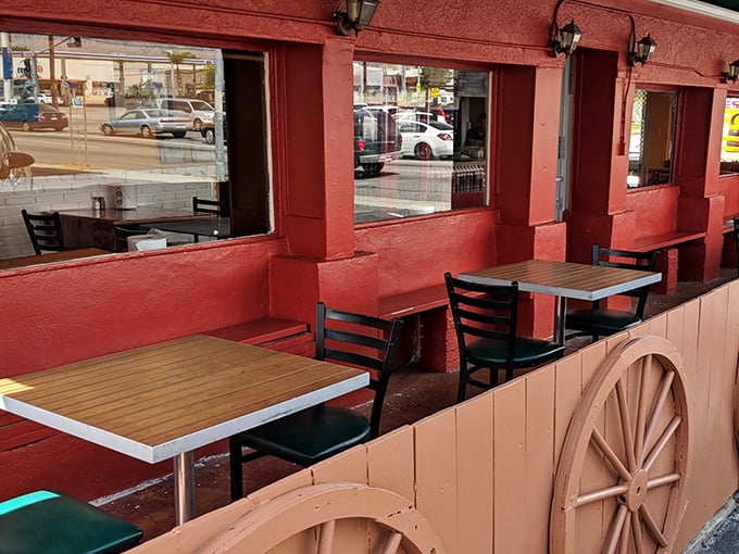 The outdoor seating area feels like a friend's backyard&mdash;casual wooden tables where BBQ memories are made between bites.