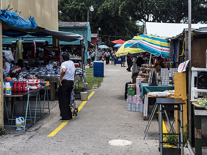 Vendors line both sides of this bustling walkway, creating a gauntlet of temptation for even the most disciplined shopper.
