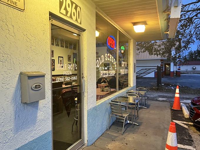 As evening falls, that iconic traffic cone stands guard outside, like a loyal sentinel protecting Fort Myers' pizza treasure from the uninitiated. 