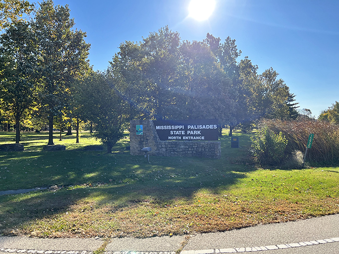 The entrance sign stands like a humble gatekeeper, never bragging about the natural wonders it's been guarding since before TikTok made everything "content."