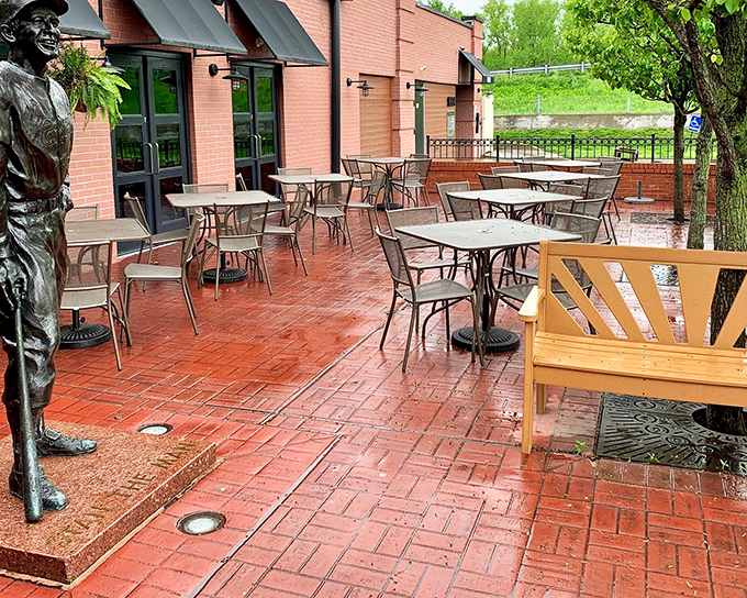 Outdoor seating that invites you to enjoy your sandwich alongside a baseball legend. Even statues appreciate good company.