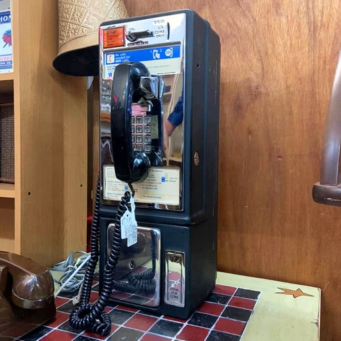 Remember when phone calls required quarters and patience? This payphone booth brings back simpler times of genuine connection.