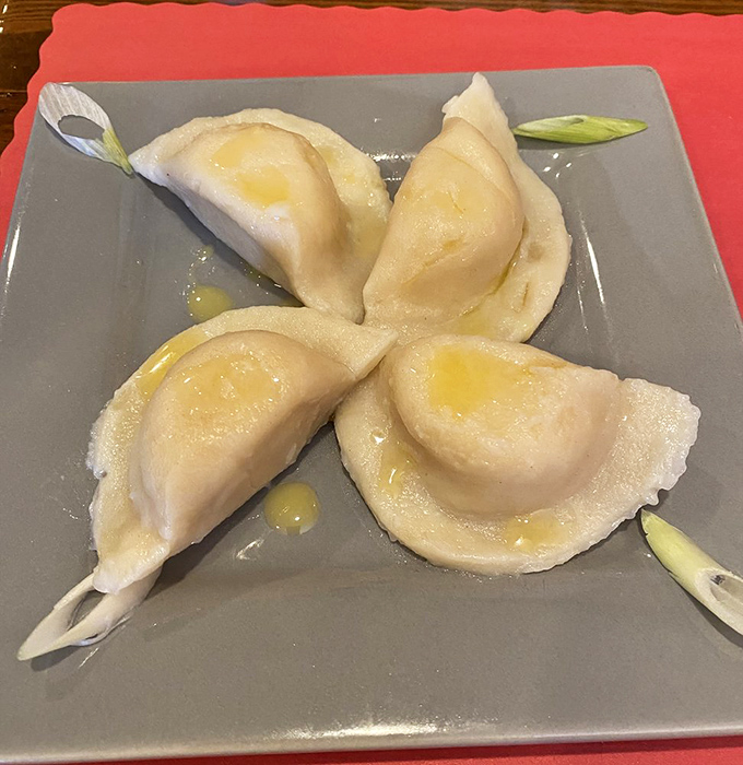 Pierogi perfection in its purest form. These plump dumplings glisten with butter like morning dew on lily pads&mdash;if lily pads were delicious.