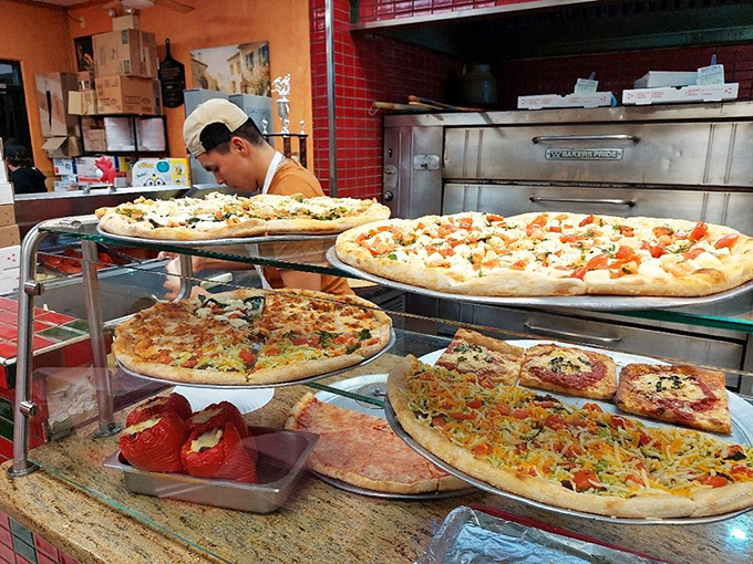 Pizza artistry in progress. Like watching Michelangelo, except you get to eat the masterpiece when it's finished.