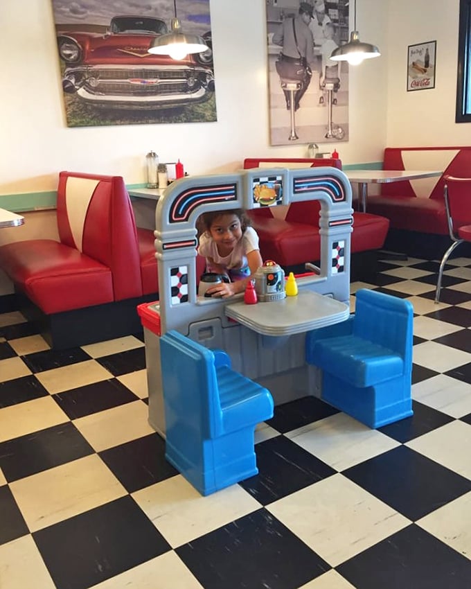 Even the kids get the full diner experience with their own mini-booth. Future food critics in training start here, learning the importance of proper ketchup application.