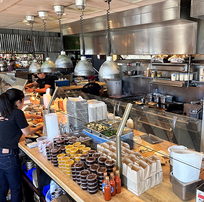 Where the magic happens&mdash;a bustling production line where smoke meets meat. Like watching a well-choreographed dance, if the dancers were handling brisket instead of ballet shoes.