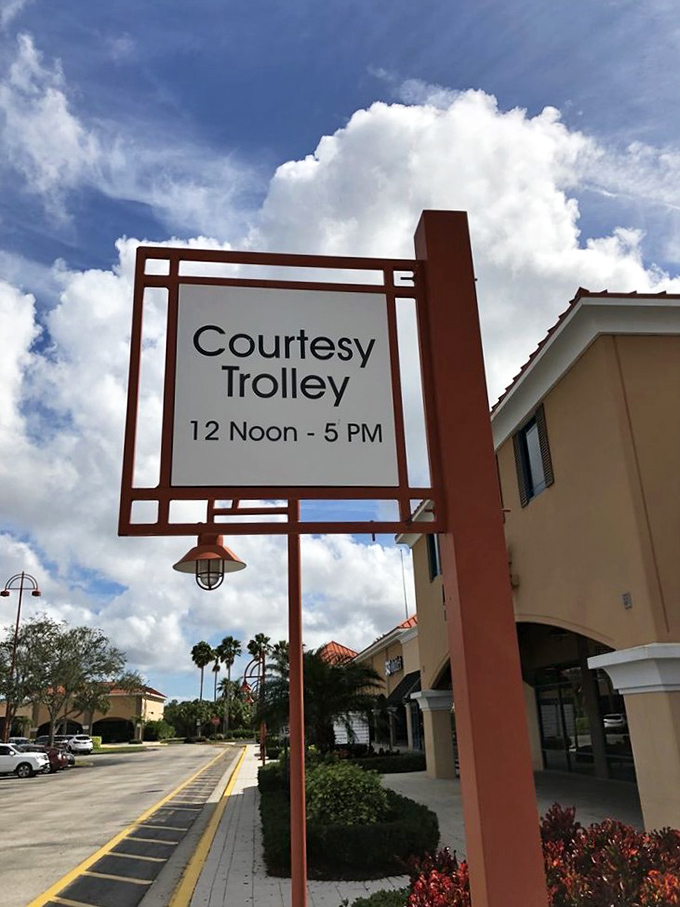 The courtesy trolley sign: Florida's version of "You shall not pass... without checking out more stores" from noon to 5 PM daily.
