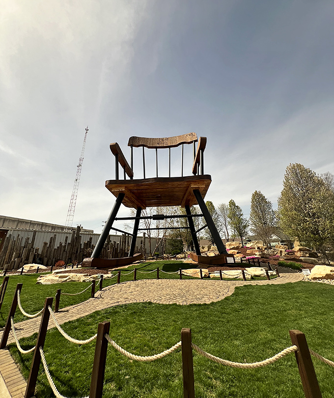 The brick pathway invites visitors to approach the wooden colossus, though sadly not to climb it&mdash;insurance nightmares await.