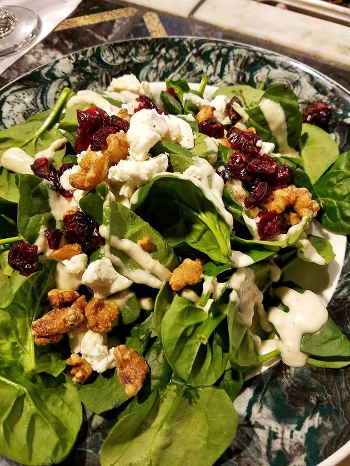 A salad that actually excites&mdash;crisp greens playing host to creamy cheese, tart cranberries, and crunchy nuts. No sad desk lunch here!