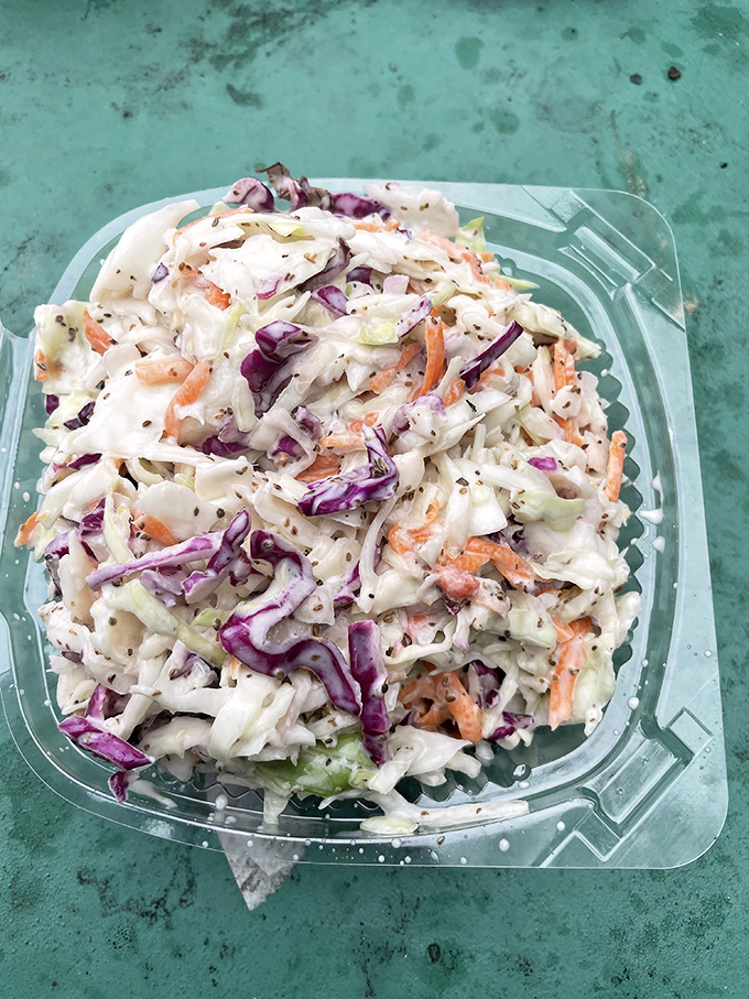 Coleslaw: the unsung hero of BBQ plates everywhere. This crunchy, colorful medley cuts through the richness like a refreshing summer breeze.