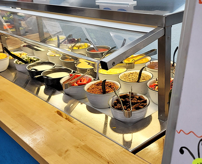 A prep station loaded with fresh toppings stands ready for action&mdash;the breakfast equivalent of an artist's palette waiting to create morning masterpieces.