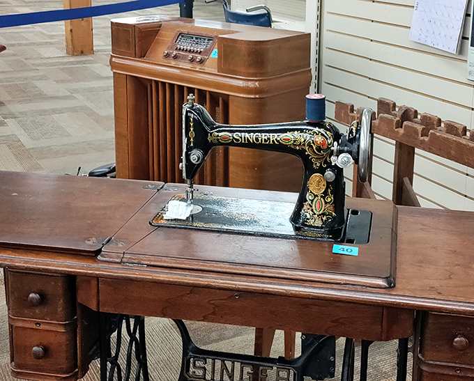 A vintage Singer sewing machine waits for its next chapter. Once the heartbeat of someone's home, now a piece of functional history.