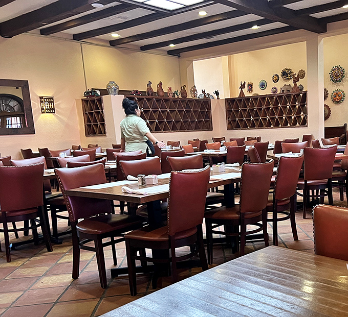 The dining room awaits its next wave of enchilada enthusiasts. Those leather chairs have supported generations of happy, full bellies.