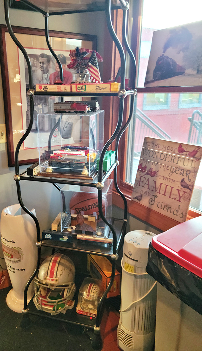 Tiny treasures in a train car! This collection of railroad memorabilia and Buckeye pride creates the perfect backdrop for your dining adventure.