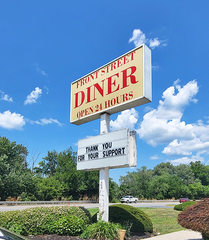 That sign isn't just announcing a diner; it's promising a 24-hour sanctuary where pancakes are always a possibility.