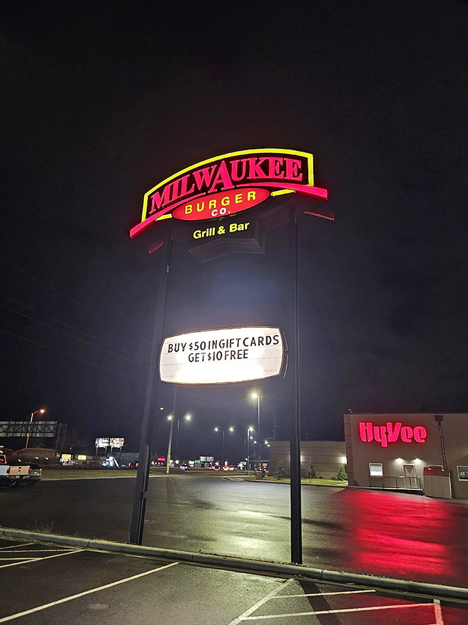 The neon sign glows like a North Star for the hungry, promising salvation in the form of burgers and brews to weary travelers.