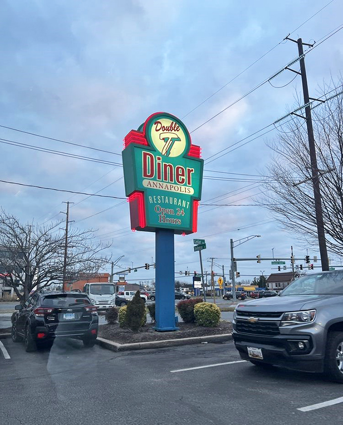 That neon sign glowing against the twilight sky isn't just advertising&mdash;it's a lighthouse guiding hungry souls to 24-hour breakfast salvation.