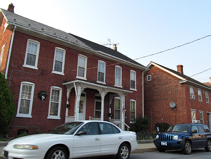 These classic brick rowhouses with delicate white porches tell stories of generations who understood that good neighbors make the best security systems.