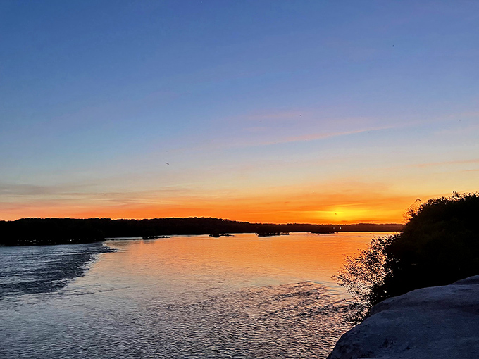 Sunset transforms the Susquehanna into liquid gold, while limestone cliffs provide nature's most dramatic viewing platform.