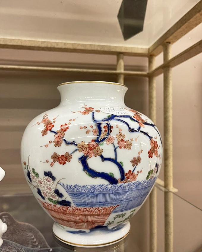 Delicate porcelain with cherry blossoms tells stories of distant artisans. Someone's grandmother protected this vase for decades before it landed here.