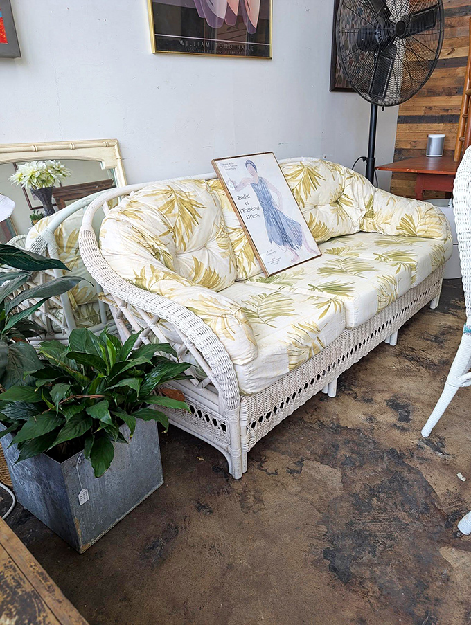 This wicker sofa with tropical cushions isn't just furniture&mdash;it's a vacation for your living room. Golden palms included, no sunscreen required.