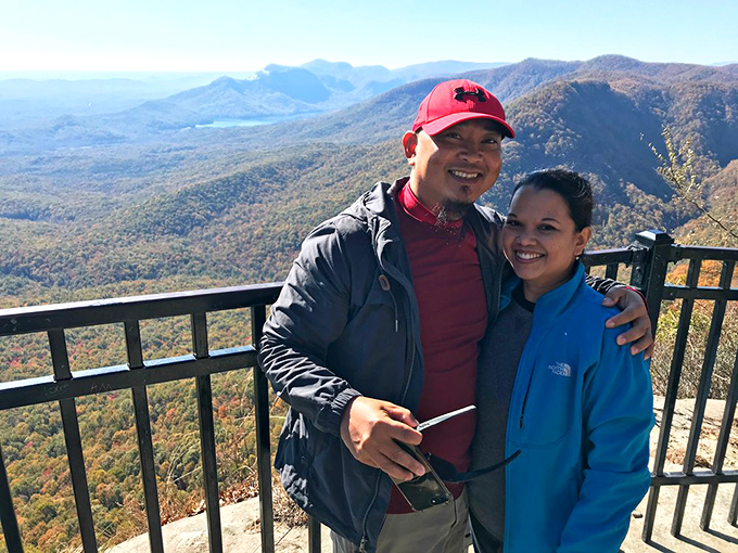 The view makes for perfect selfie moments, though I suspect these smiling visitors would remember this panorama even without digital evidence. Some memories don't need Instagram filters.