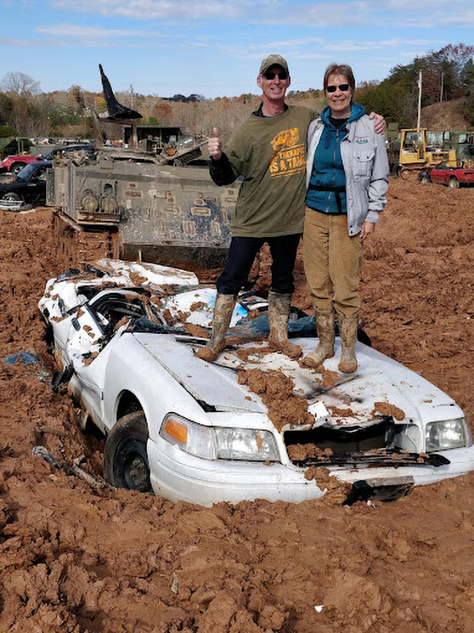 "We came for the tanks, stayed for the crushed metal souvenirs." Happy visitors celebrate atop their automotive conquest with muddy boots and clean consciences.