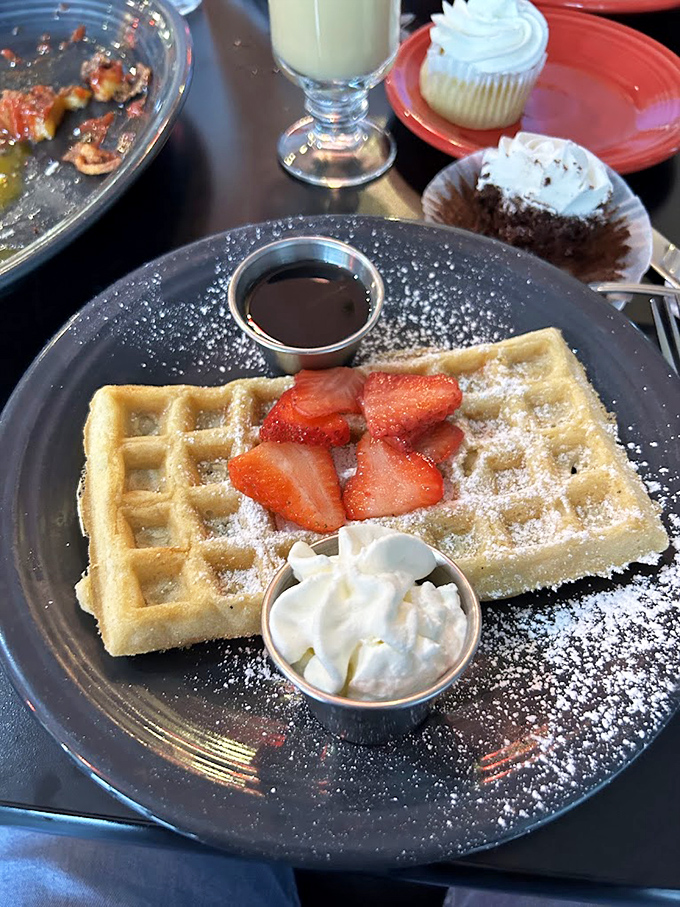 Waffle perfection isn't complicated&mdash;crisp exterior, fluffy interior, fresh strawberries, and enough powdered sugar to make your dentist wince. Worth every calorie.