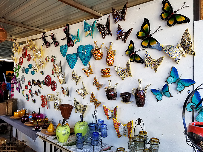 Wall-mounted butterflies and decorative hearts transform simple stalls into galleries of folk art. These aren't mass-produced decorations&mdash;they're expressions of borderland creativity.