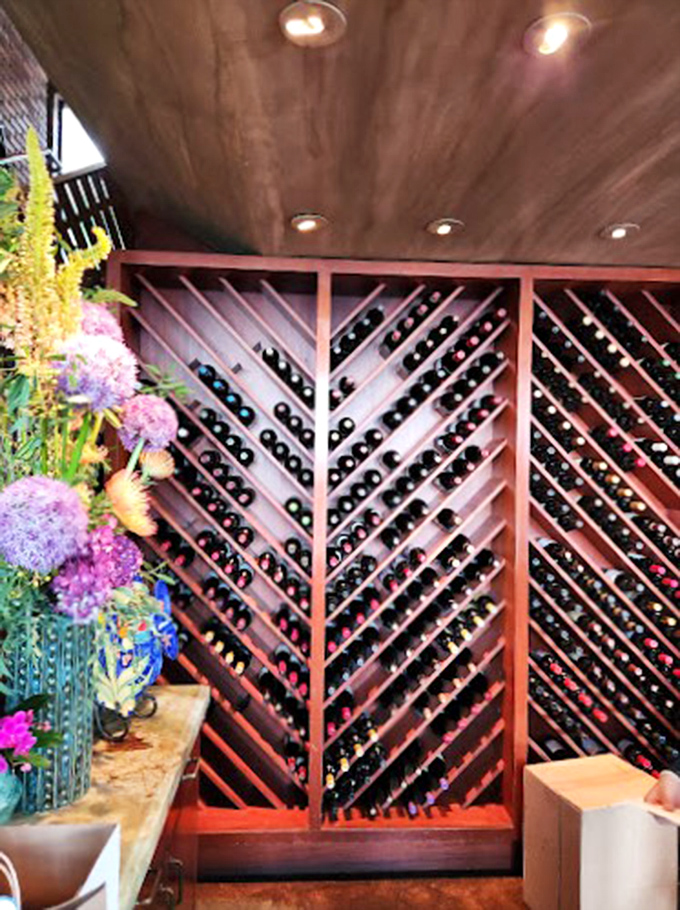 Wine racks that make your home collection look like amateur hour. Each bottle waits patiently for its moment to shine at your table.