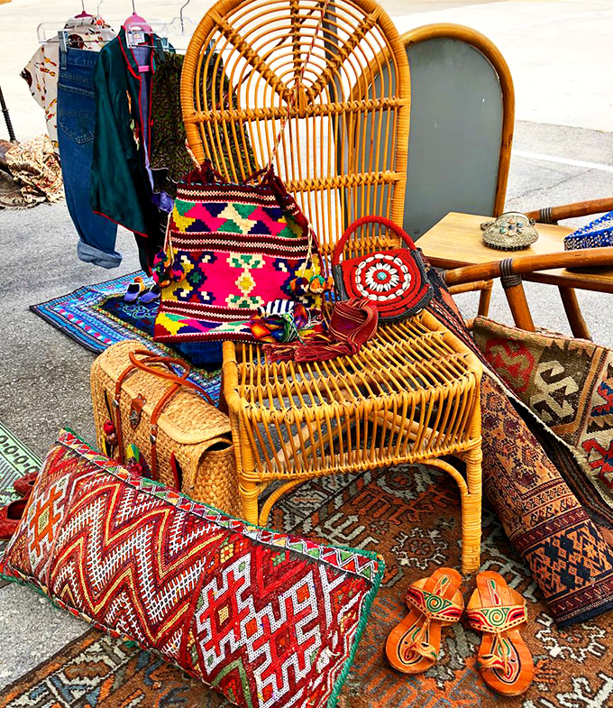 Peacock chairs and colorful textiles create a bohemian paradise that screams Instagram-worthy home decor.