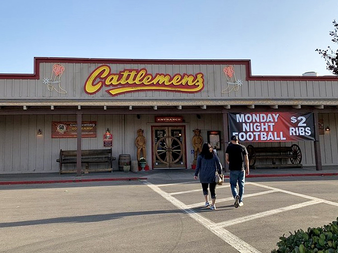 Cattlemen's Western-themed entrance sets the perfect tone. Those wagon wheel doors swing open to reveal a ranch-style steakhouse experience that's pure California cowboy.