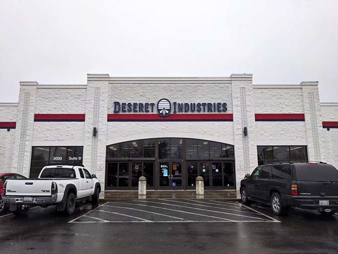 Deseret Industries' crisp white building with its distinctive red stripe stands ready to transform your home without demolishing your budget.