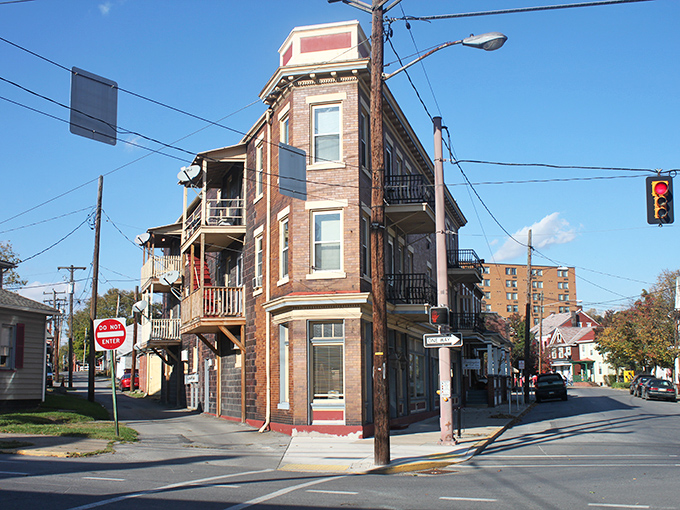 Corner conversation piece! Huntingdon's multi-balconied building stands like the architectural equivalent of a well-traveled retiree with stories to tell.
