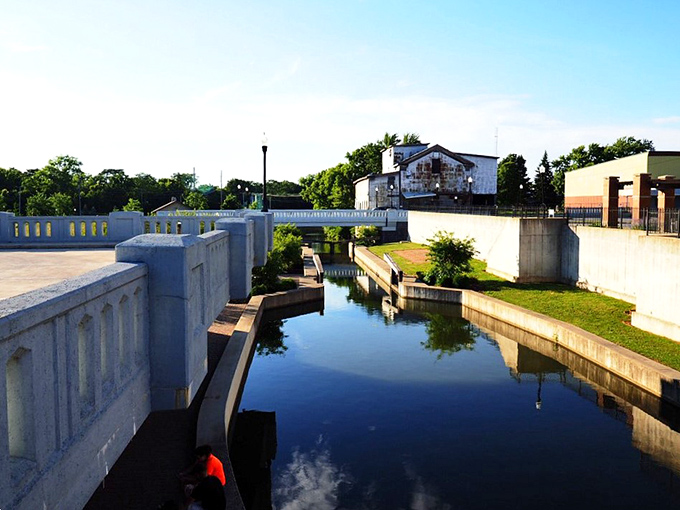 Canal waters reflect blue skies, creating a mirror effect that doubles the beauty and halves your stress levels.