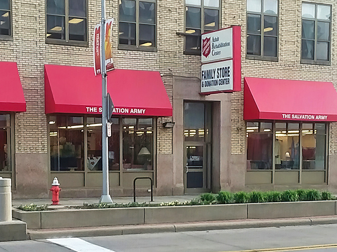 The Salvation Army's historic brick building with cherry-red awnings exudes character. Even the architecture tells you this place has stories to share.