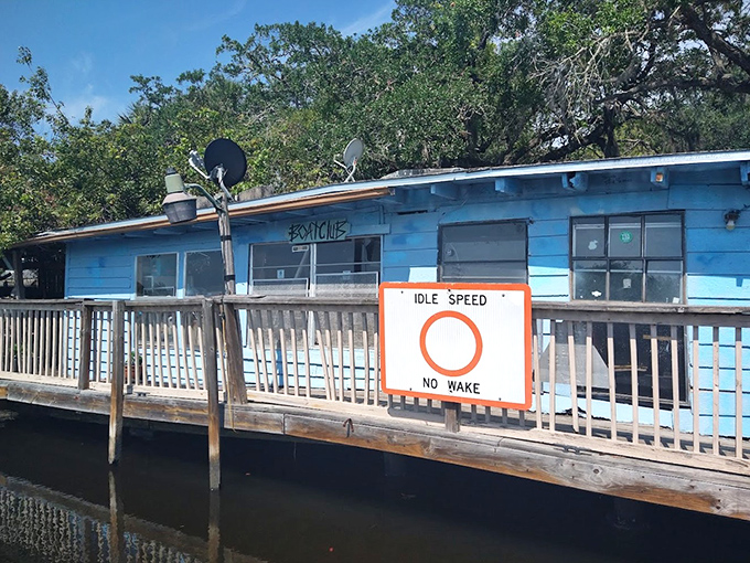 This blue shack on stilts offers the unique experience of watching fish swim beneath you while you drink.