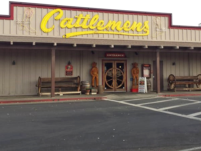 Wooden figures guard the entrance to beef paradise. Cattlemen's Selma location embraces its Western heritage with decor that would make John Wayne feel right at home.