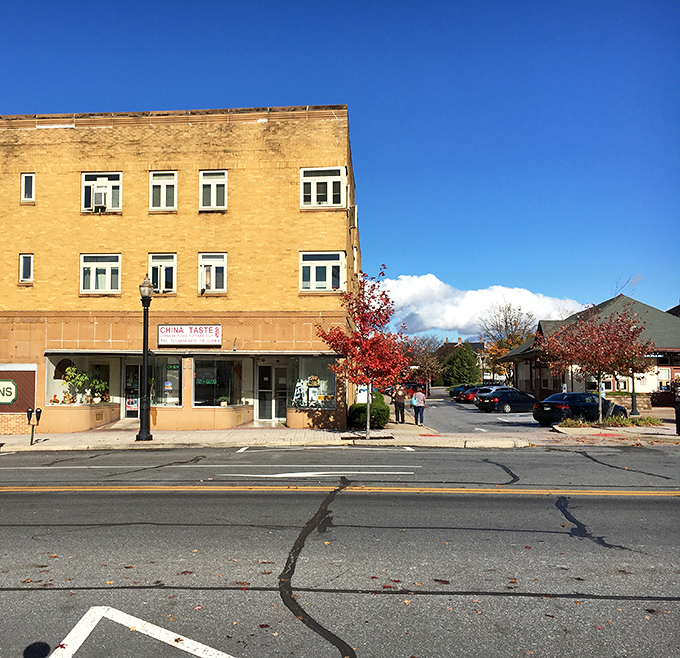 Main Street America with autumn colors and mountain views - postcards can't capture this kind of charm.