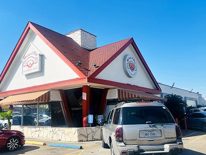 The cheerful red roof of House of Pies signals you've arrived at Houston's round-the-clock breakfast paradise.