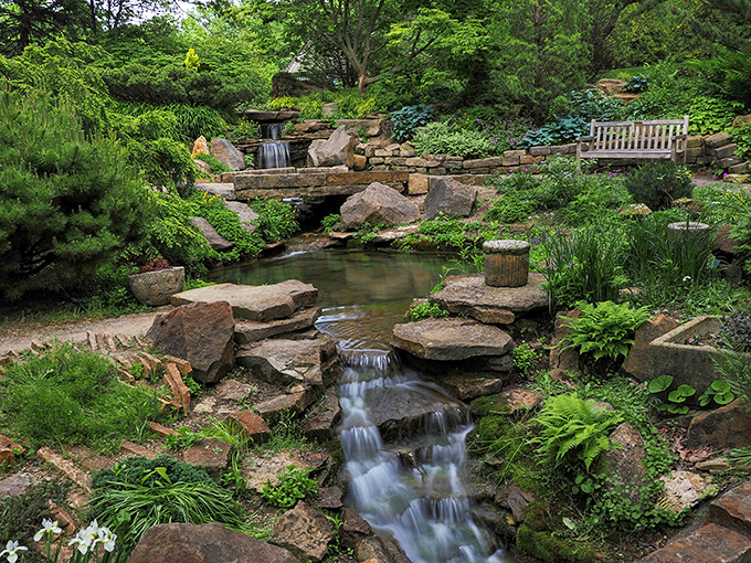 Serenity flows through these winding garden paths, where water and stone create a peaceful retreat from everyday life.