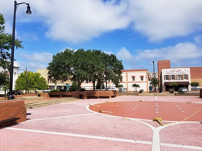 You can relax under the shade of mature trees in this open brick plaza while soaking in the local atmosphere.