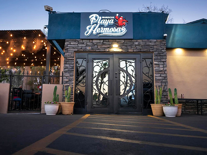 Evening at Mariscos Playa Hermosa feels magical with twinkling lights. Those ornate doors open to a world of authentic Mexican seafood delights.