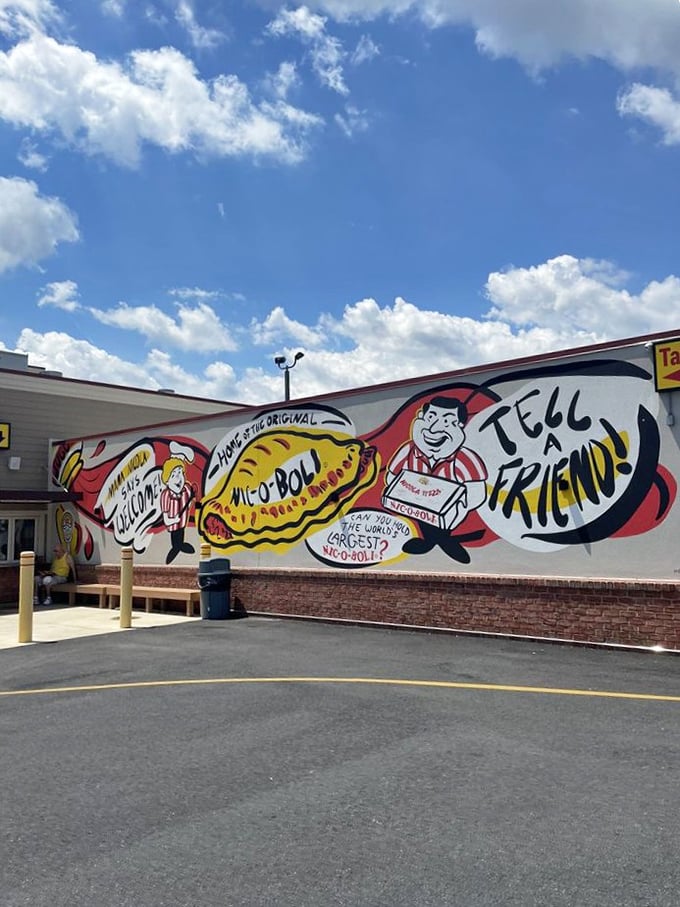 "Tell a friend!" The mural says what satisfied customers already know. Nicola's pizza is too good to keep secret.